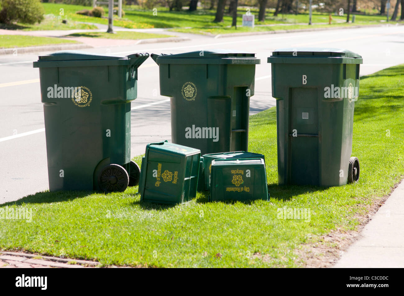 Trash bins on street Stock Photo - Alamy