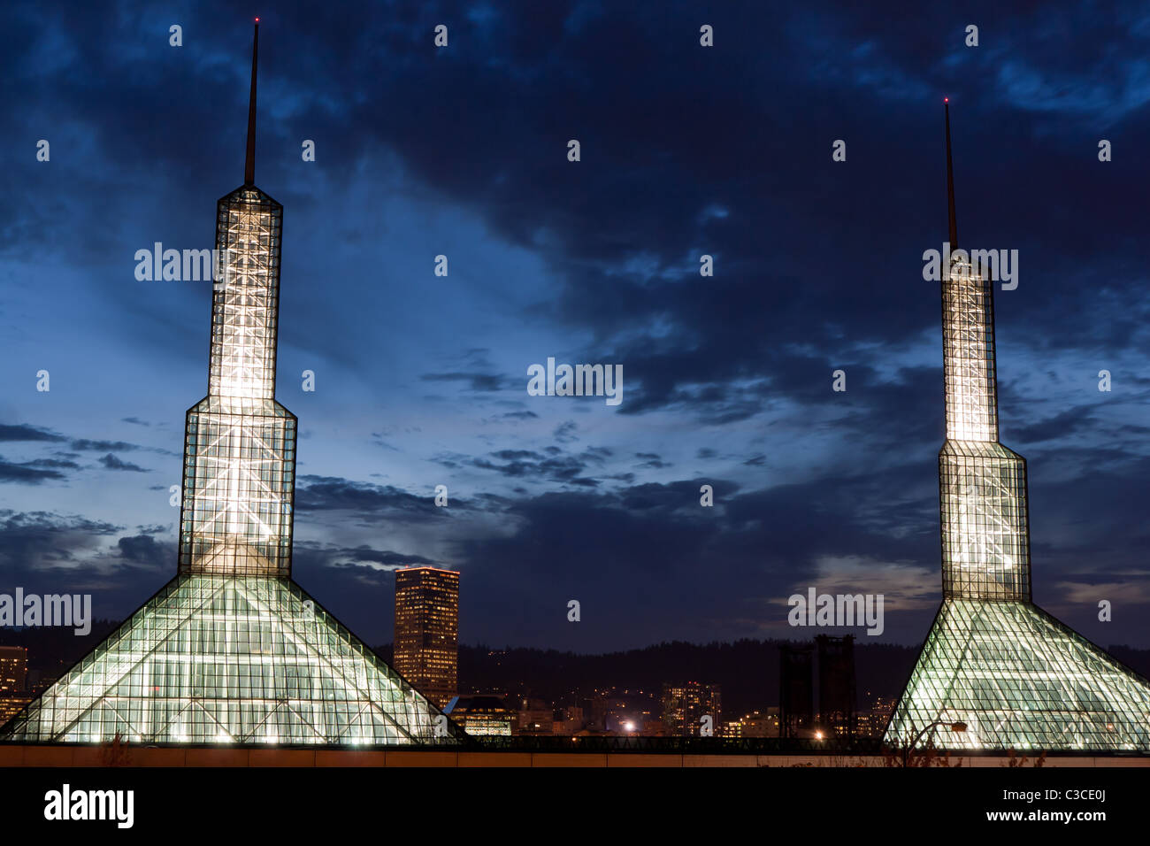 sunset in Portland with lighted distinct glass tower of Portland ...
