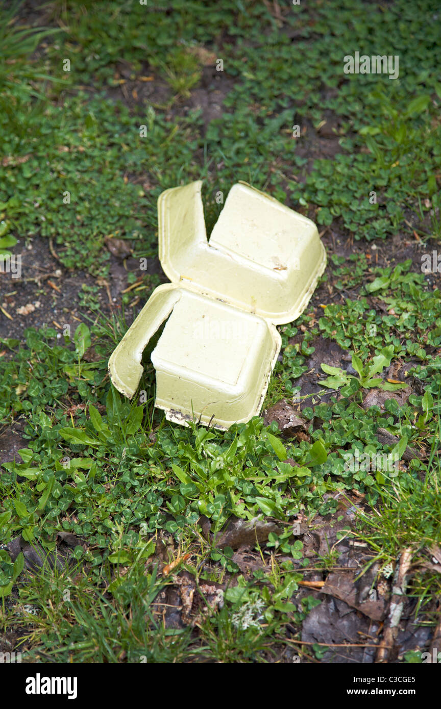 broken food yellow box on the grass Stock Photo - Alamy