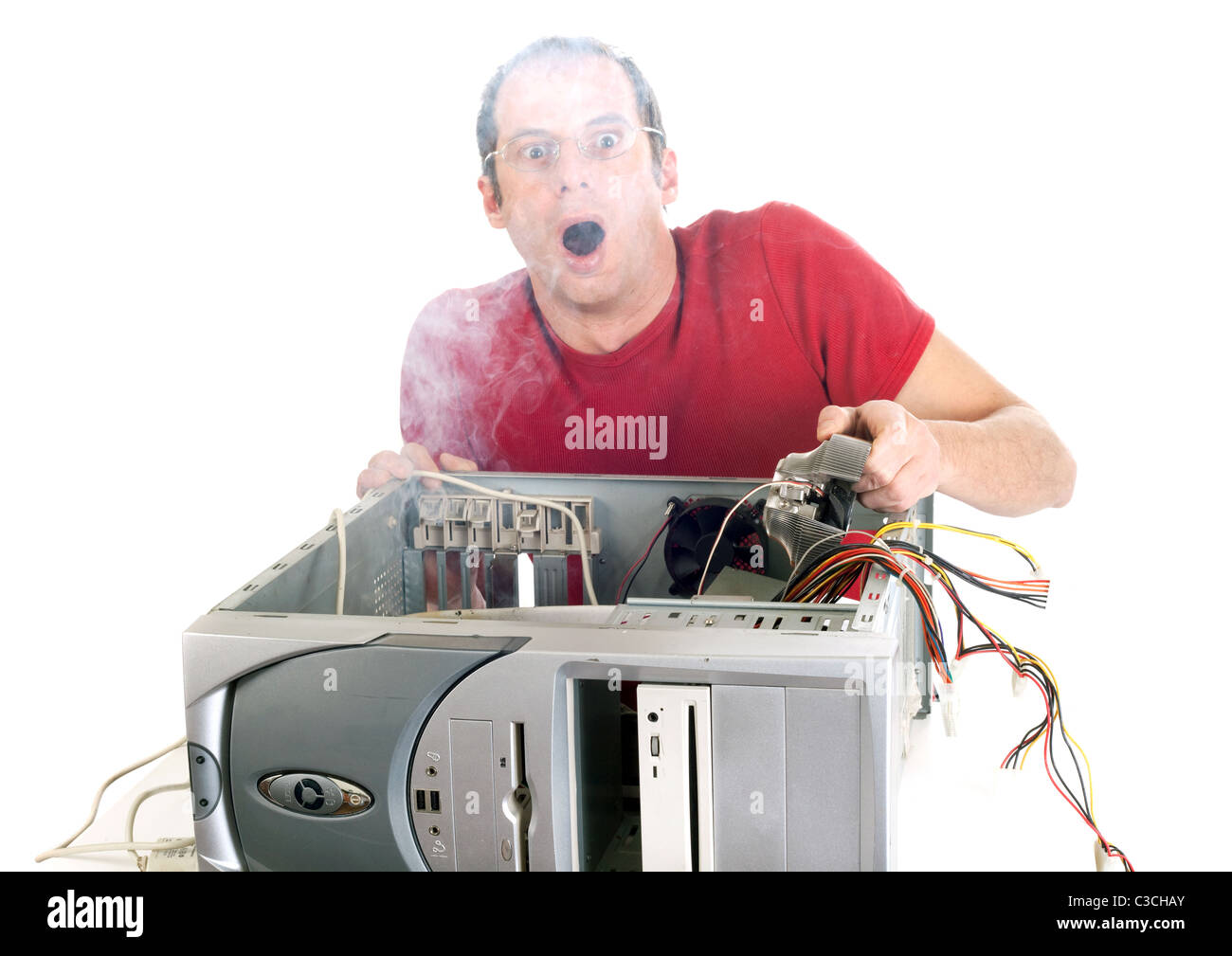 surprised man with smoke coming from computer Stock Photo - Alamy