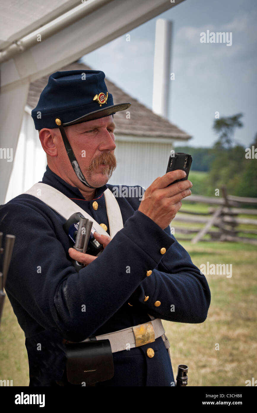 In modern contrast, a Union Marine officer reenactor dials his cell ...
