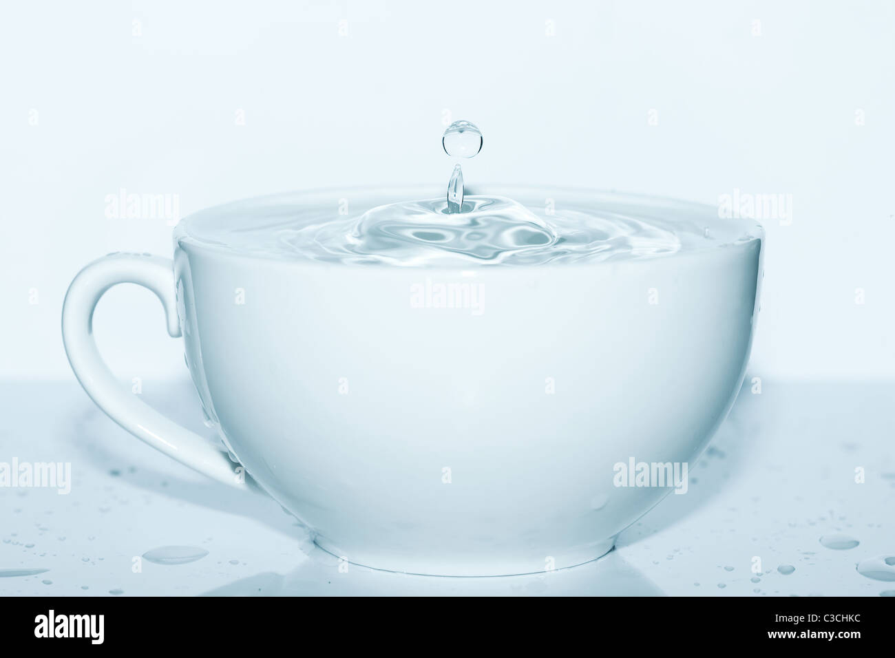 drop of water in a white cup Stock Photo - Alamy