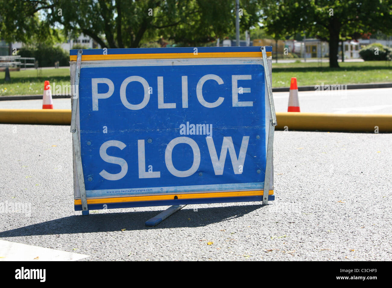 police slow sign at scene of large fire Stock Photo - Alamy