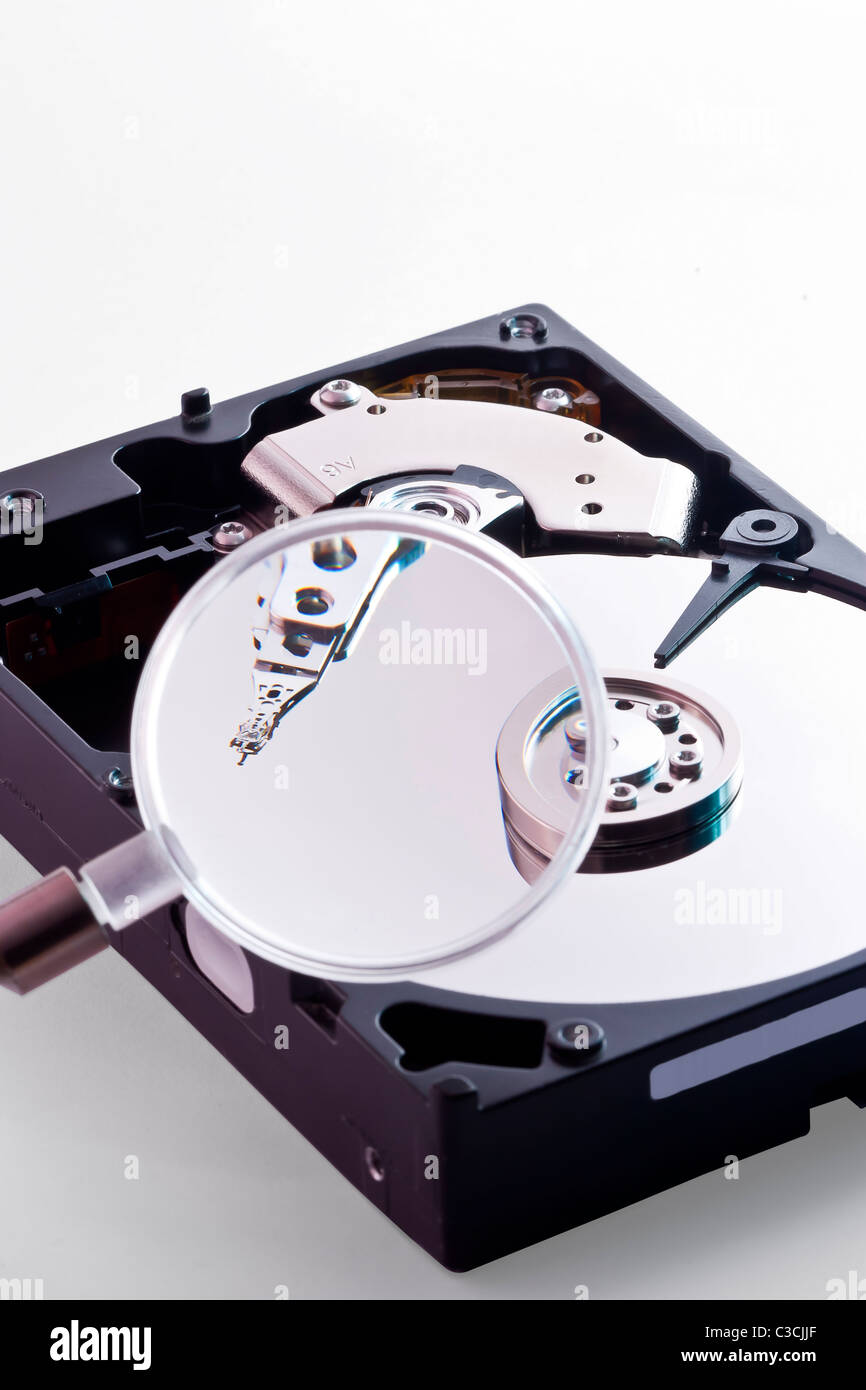 Looking for something inside a Hard Disk Drive Stock Photo - Alamy