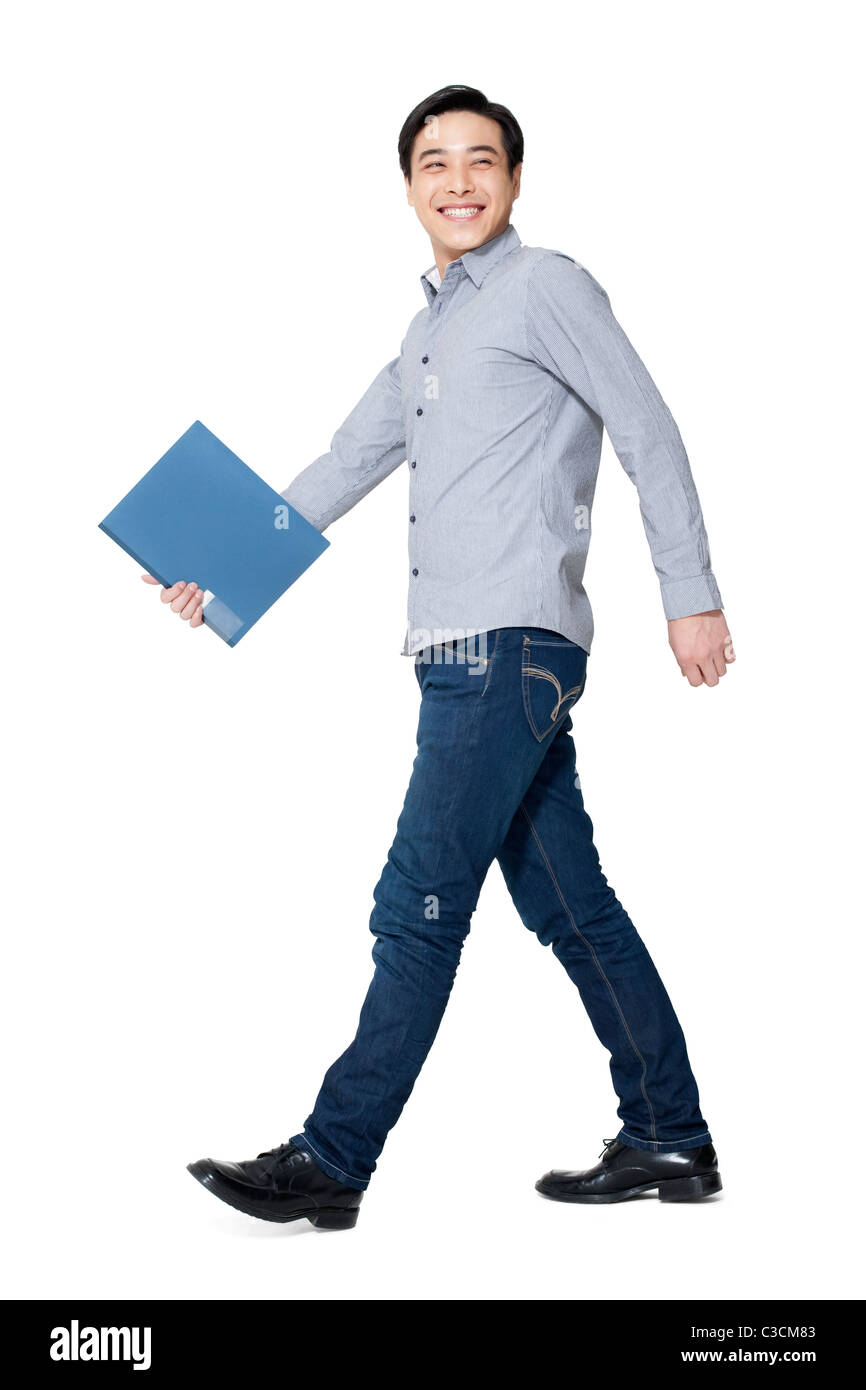Man walking on book Cut Out Stock Images & Pictures - Alamy