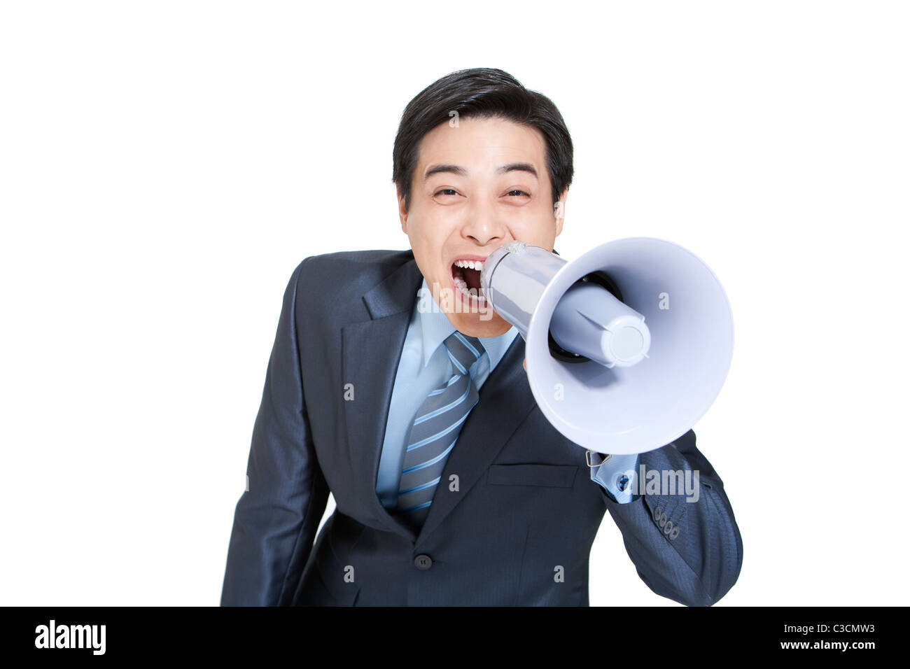 Portrait of a businessman shouting into a megaphone Stock Photo - Alamy