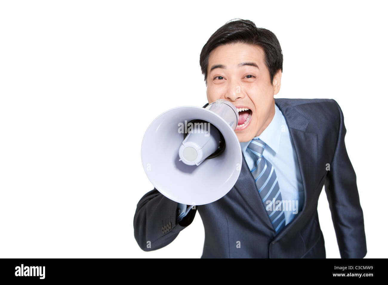 Portrait of a businessman shouting into a megaphone Stock Photo - Alamy