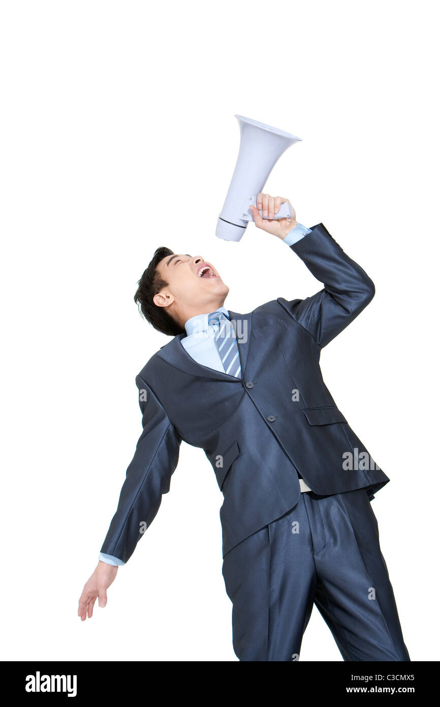 Portrait of a businessman shouting into a megaphone Stock Photo - Alamy