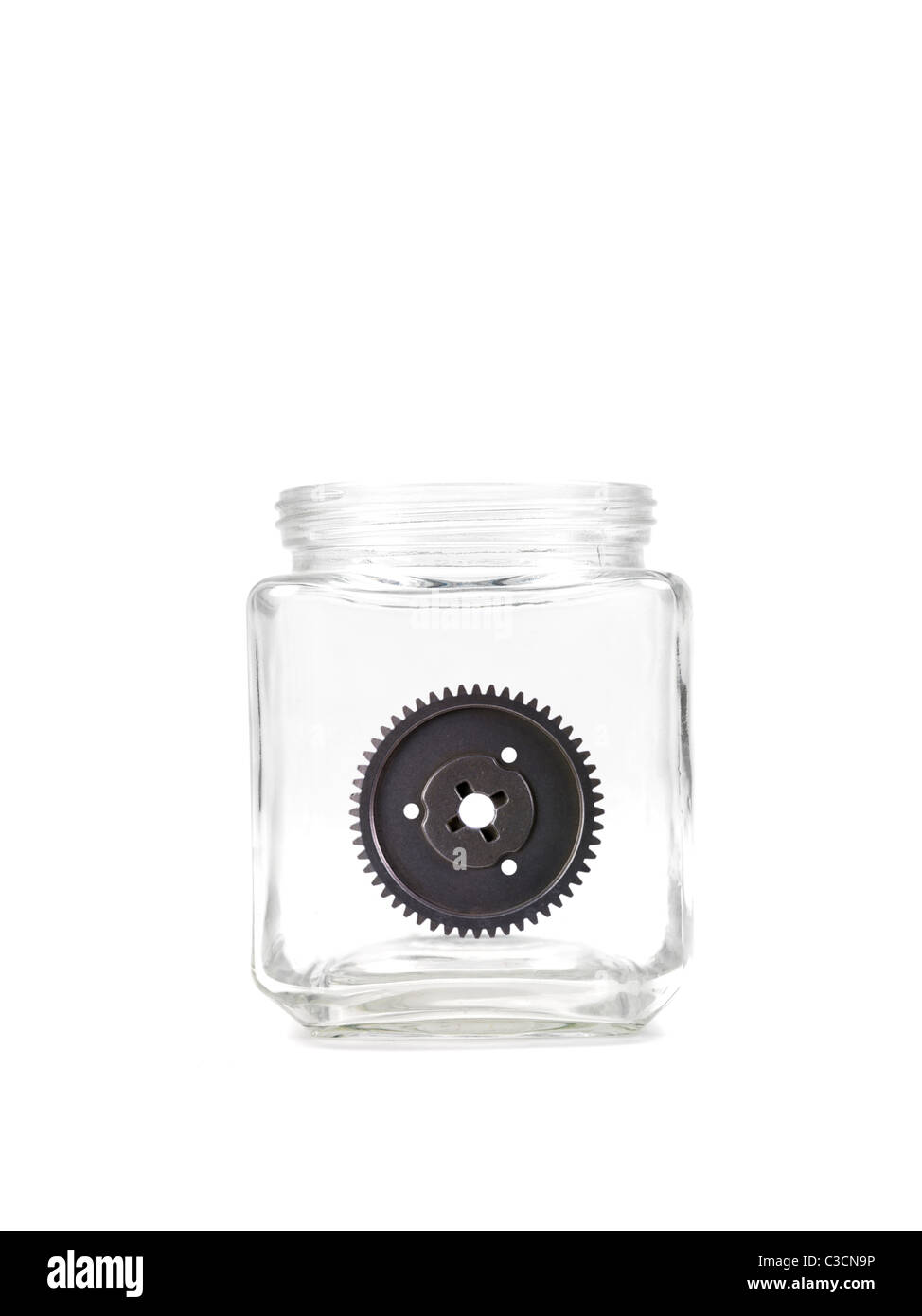 An empty money jar and a cog isolated against a white background Stock ...