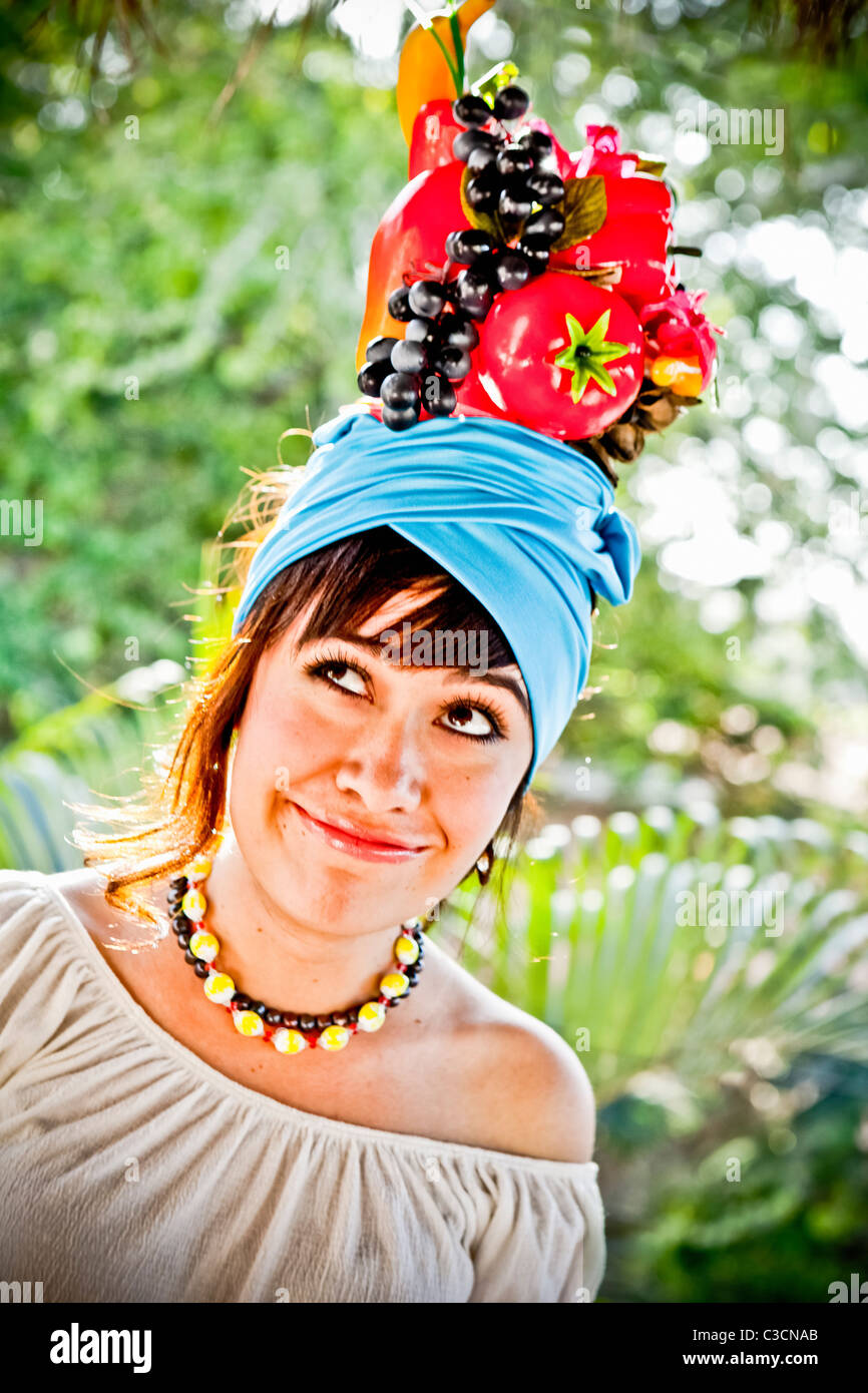 young woman wearing fruit hat Stock Photo - Alamy
