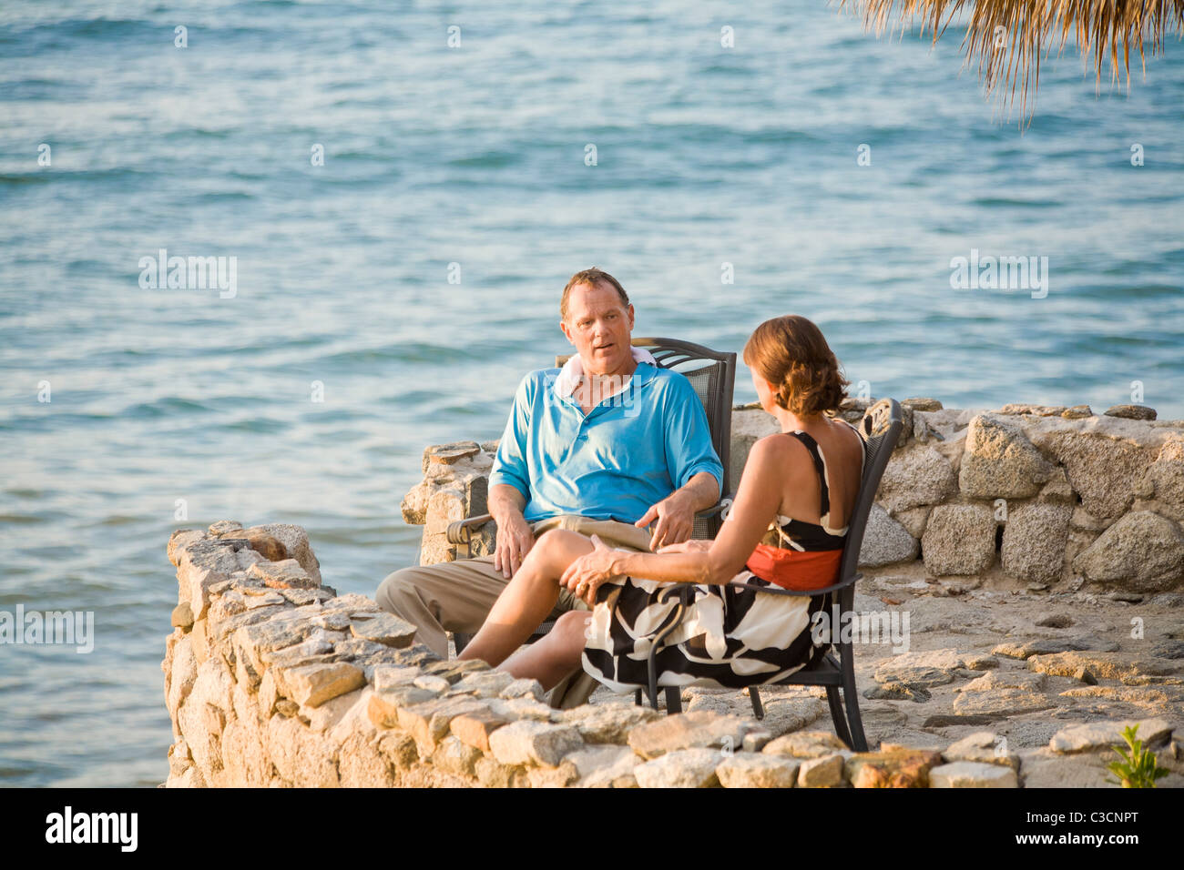 Two tourist couples sitting hi-res stock photography and images - Alamy