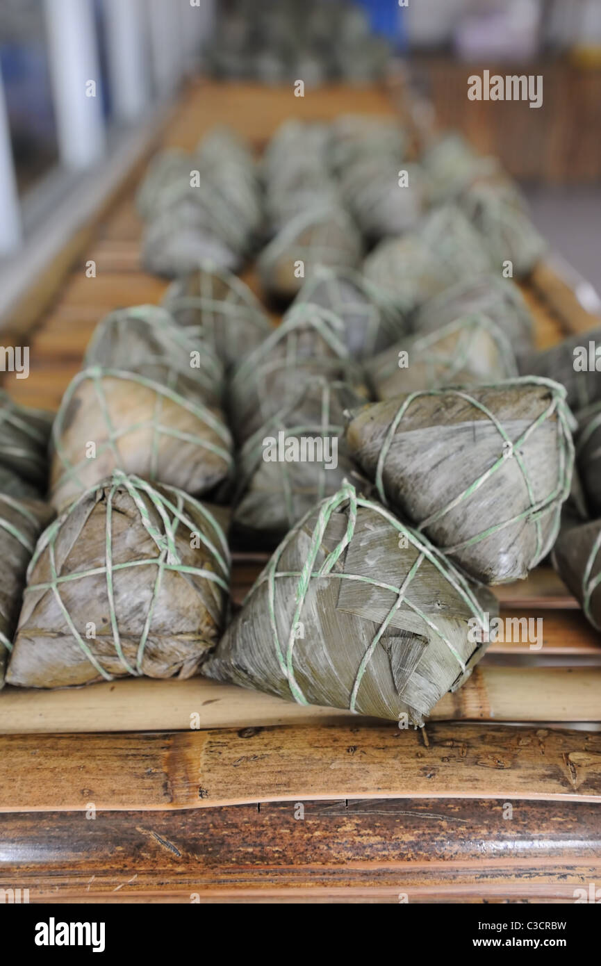 Chinese rice dumplings wrapped in reed leaves Stock Photo - Alamy