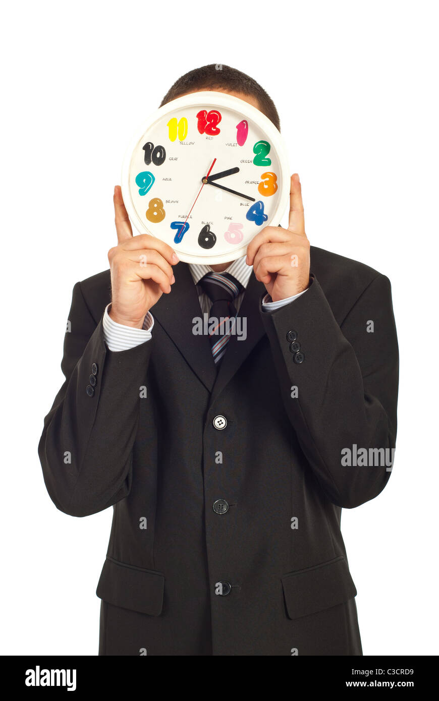 Business man covering his face with a clock isolated on white ...