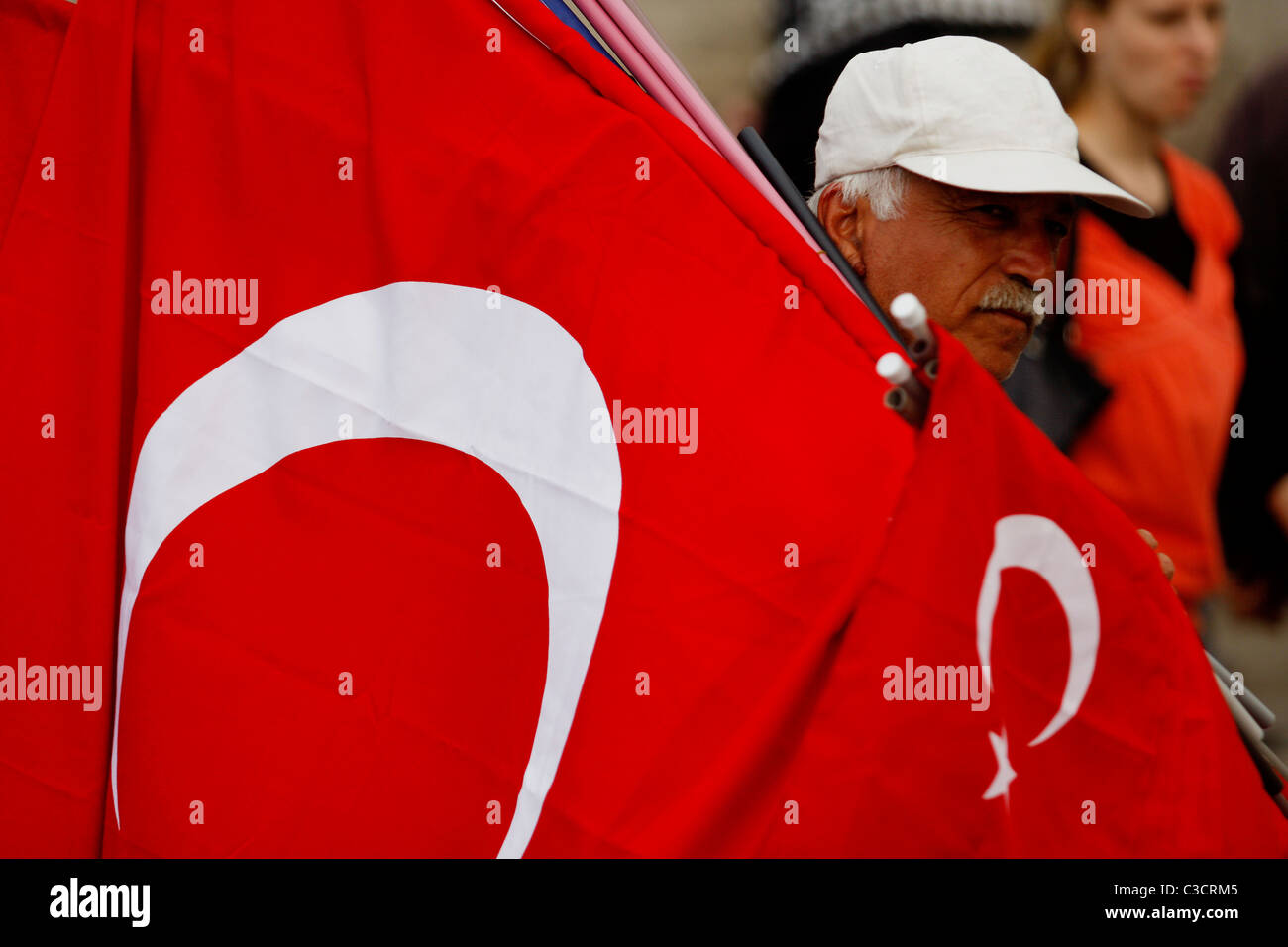 A man hangs a Turkey flag Istanbul Stock Photo - Alamy