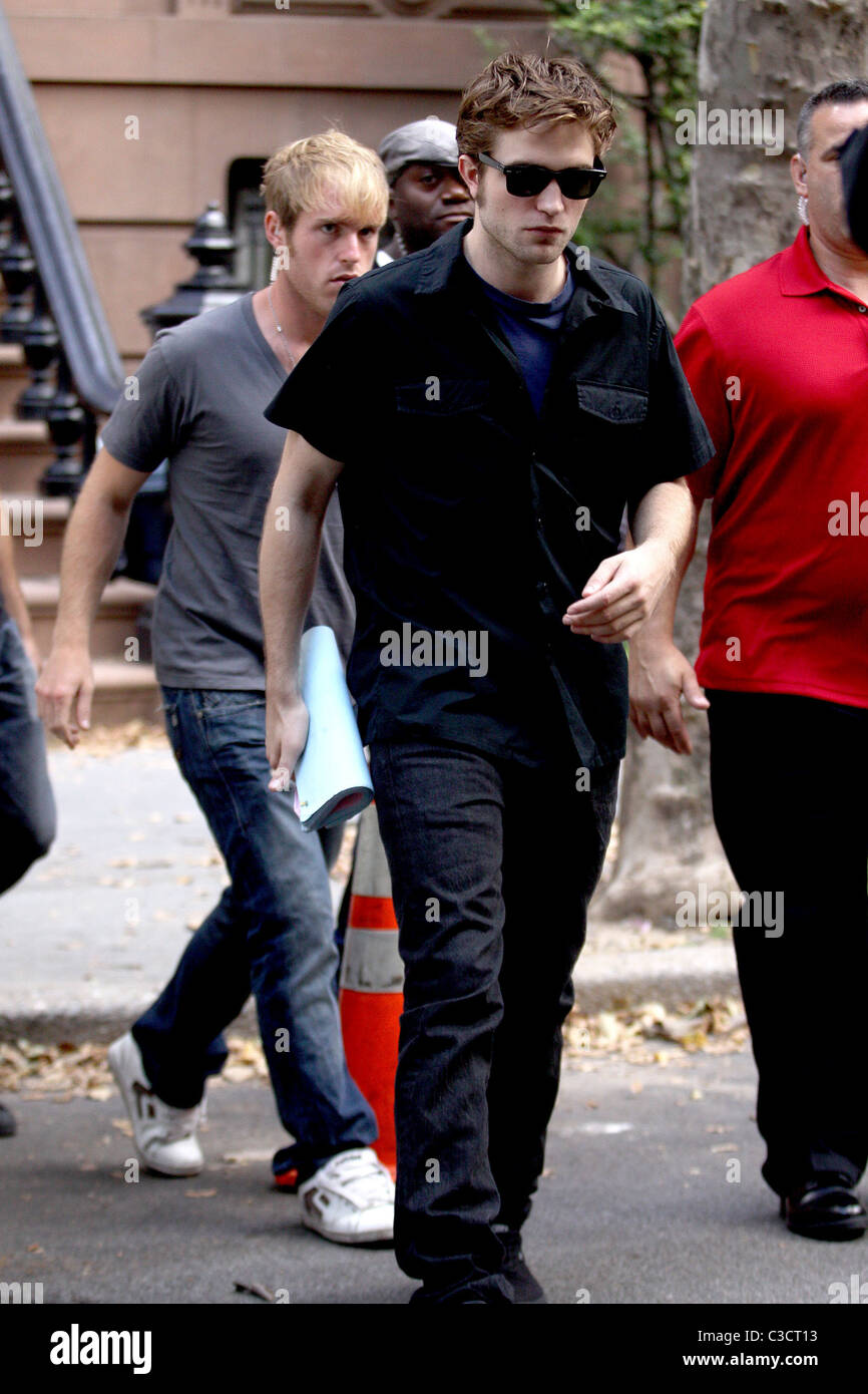 Robert Pattinson holding his script while on the set of his new film ...