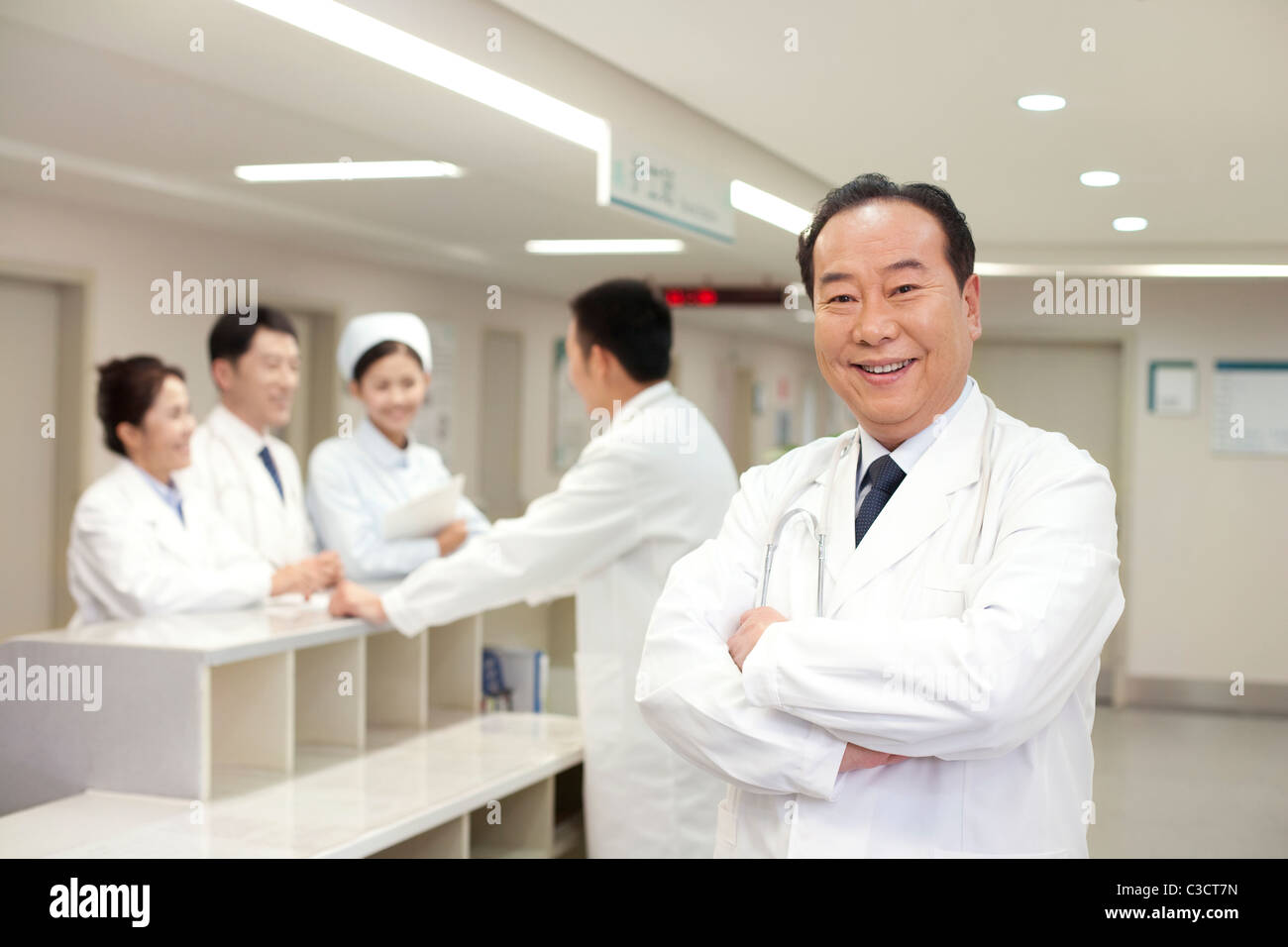 Doctor standing out in crowd hi-res stock photography and images - Alamy