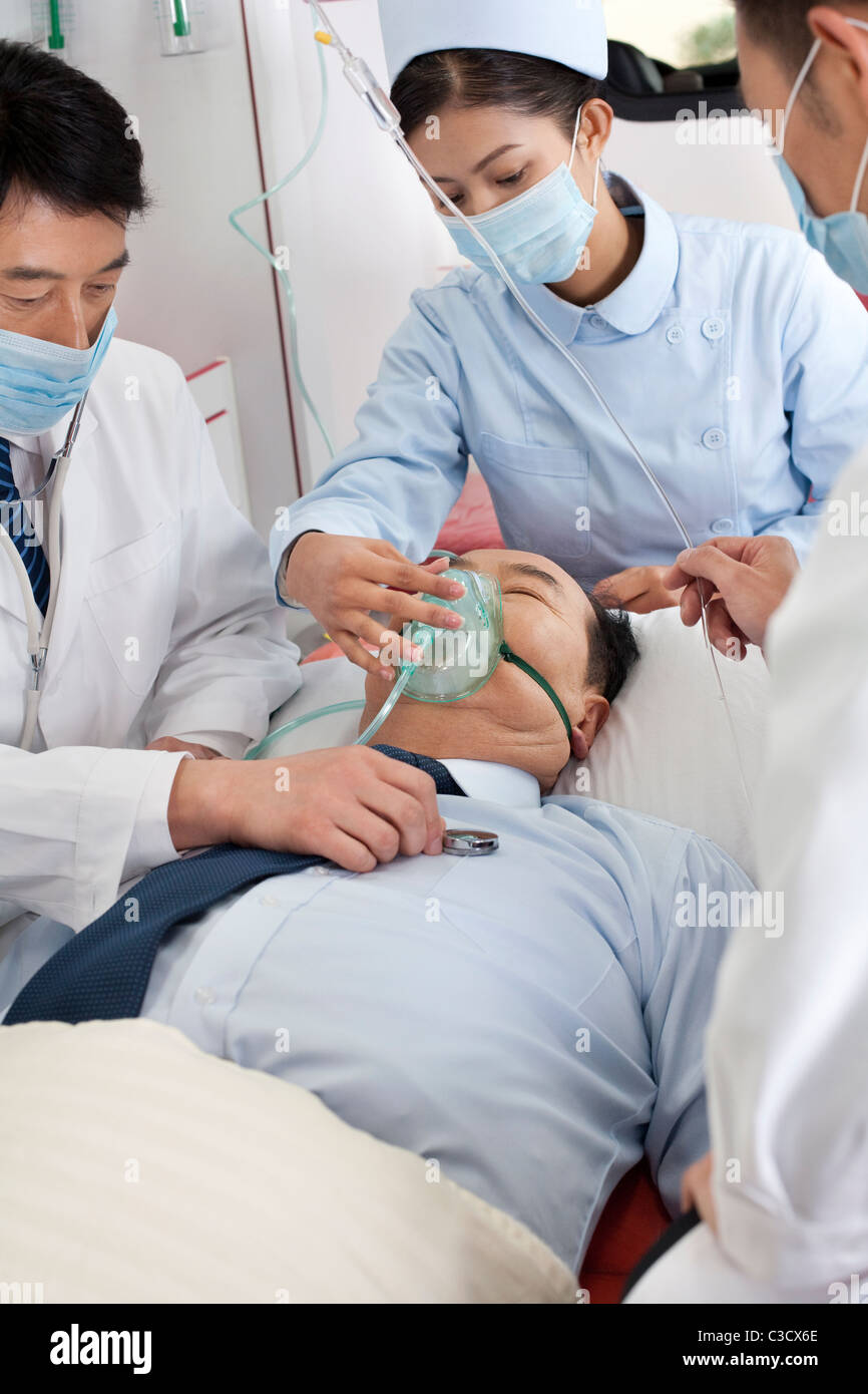 Asian medics with patient hi-res stock photography and images - Alamy