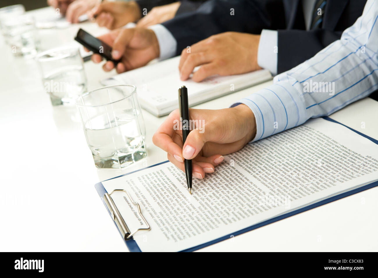 Image of row of people hands doing something at business seminar Stock ...
