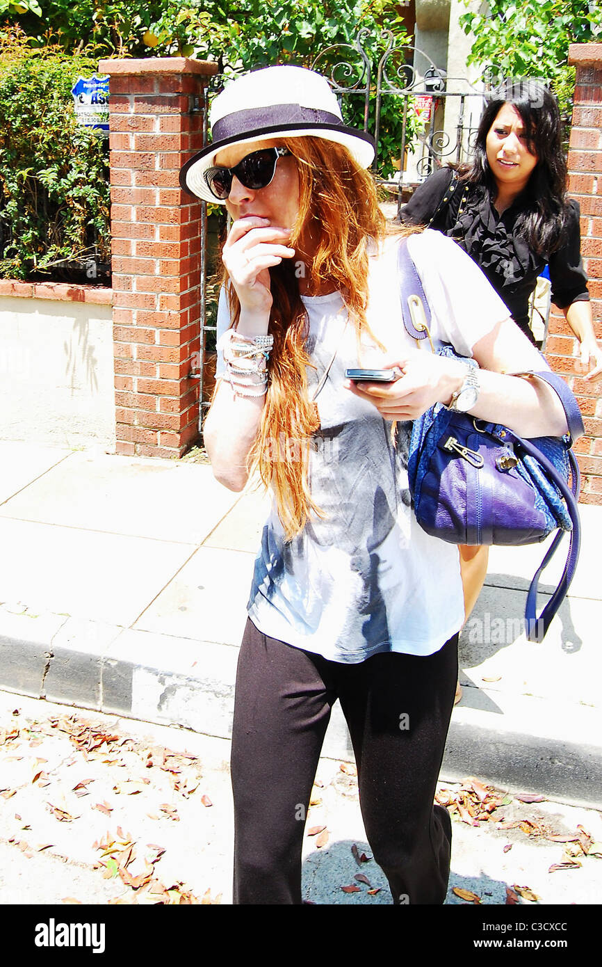 Lindsay Lohan leaving Samantha Ronson's residence in a green Volkswagen ...