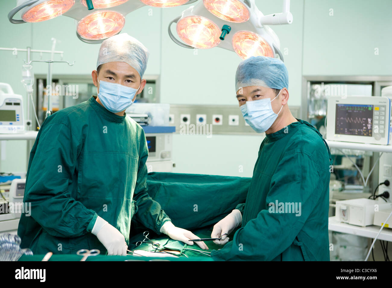 Portrait of two surgeons during surgery Stock Photo - Alamy