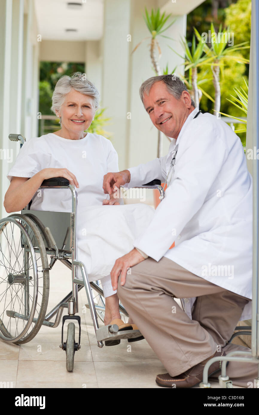 Doctor with his patient looking at the camera Stock Photo - Alamy