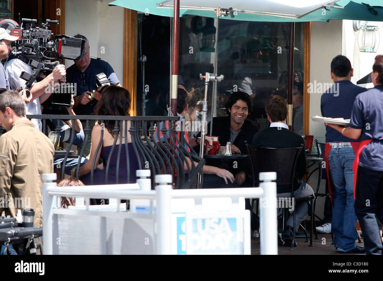 Adrian Grenier Cast members of 'Entourage' filming a scene at Urth Cafe ...