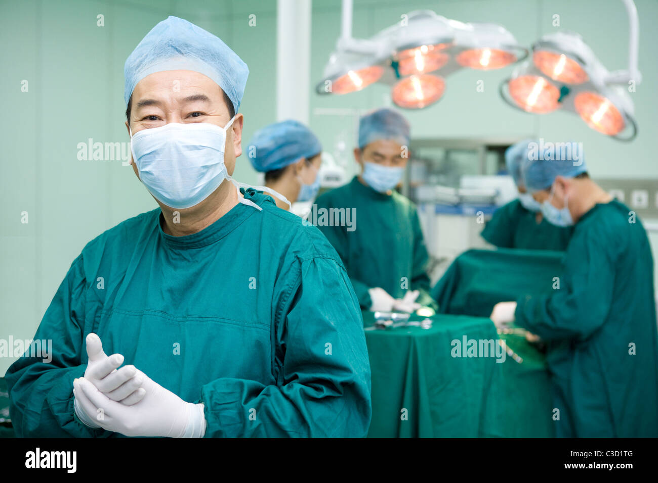 Portrait of a happy surgeon Stock Photo - Alamy