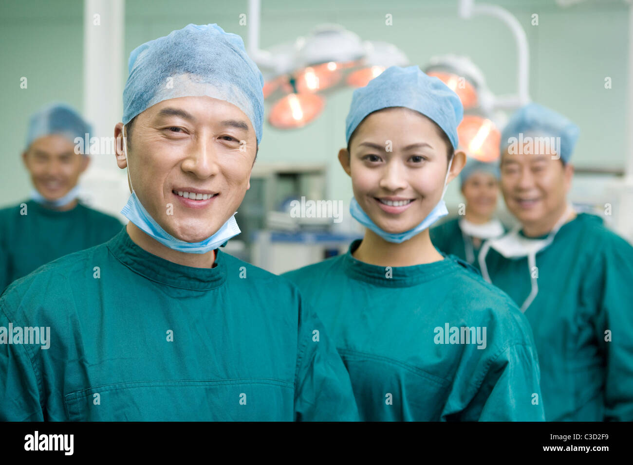 Portrait of a group of happy surgeons Stock Photo - Alamy