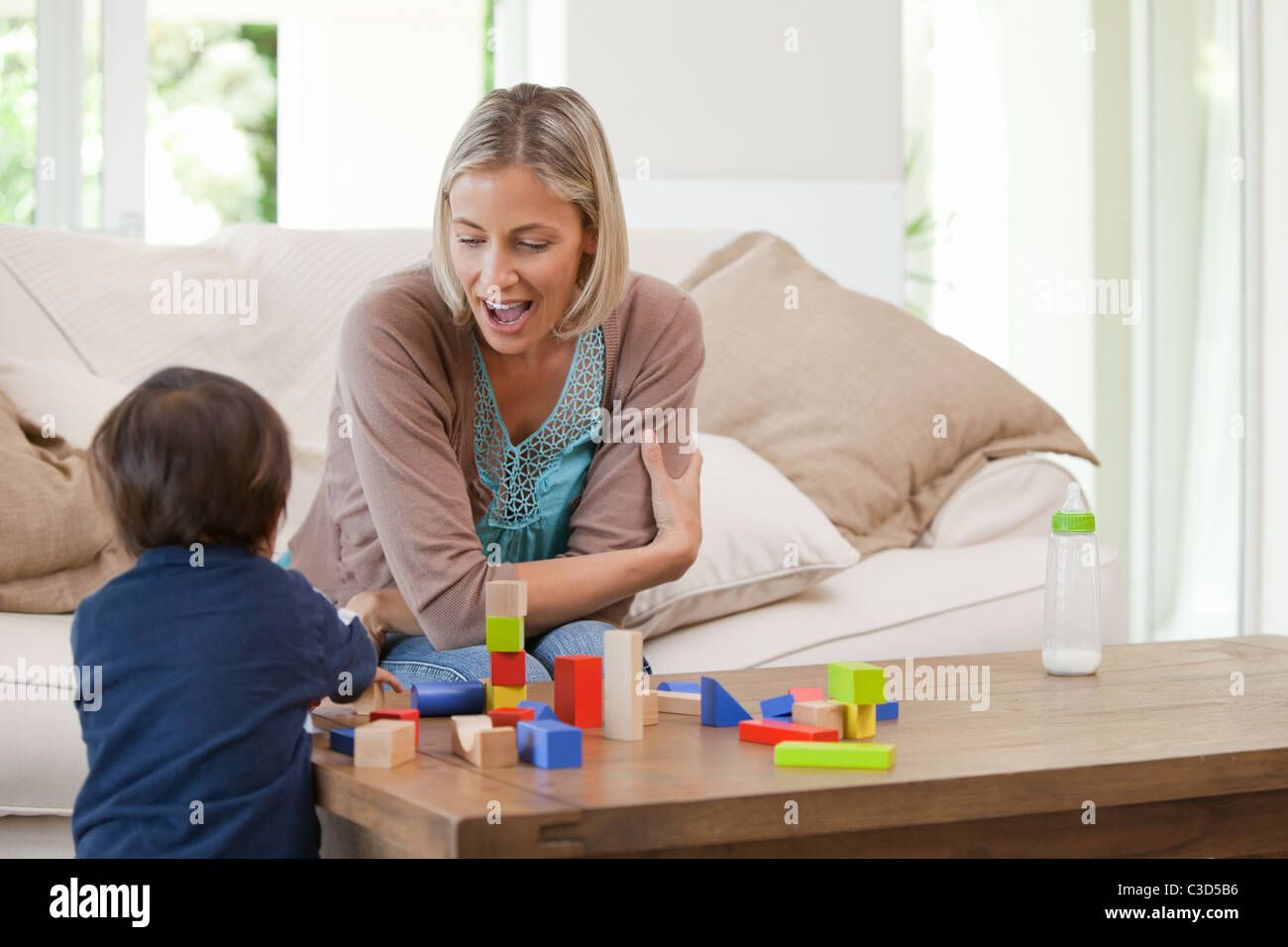 Mother playing with her child Stock Photo - Alamy