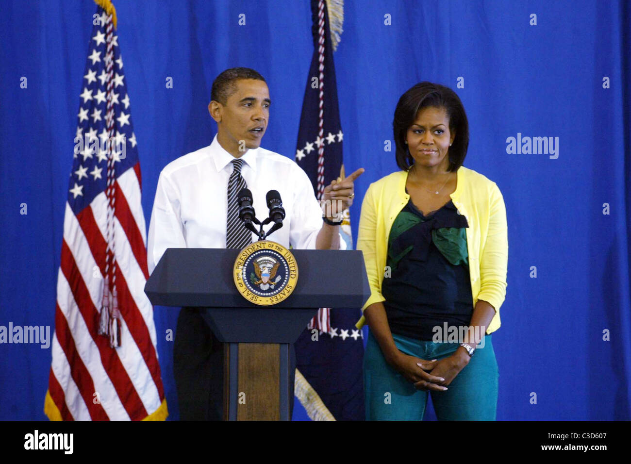 First Lady Michelle Obama watches as US President Barack Obama speaks ...