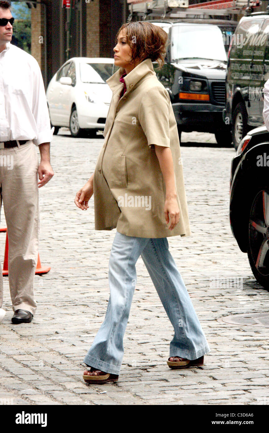 Jennifer Lopez wearing a prosthetic baby bump while on the set of her ...