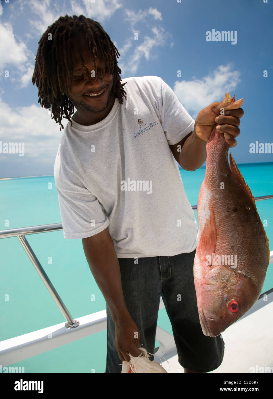 Man holds up Red Snapper Stock Photo - Alamy