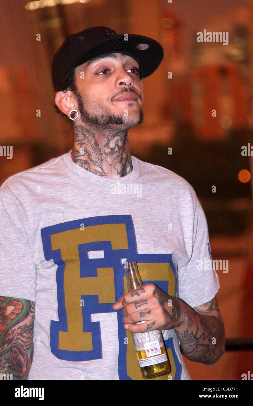 Travis McCoy relaxes backstage Paper Magazine and Ray-Ban present ...