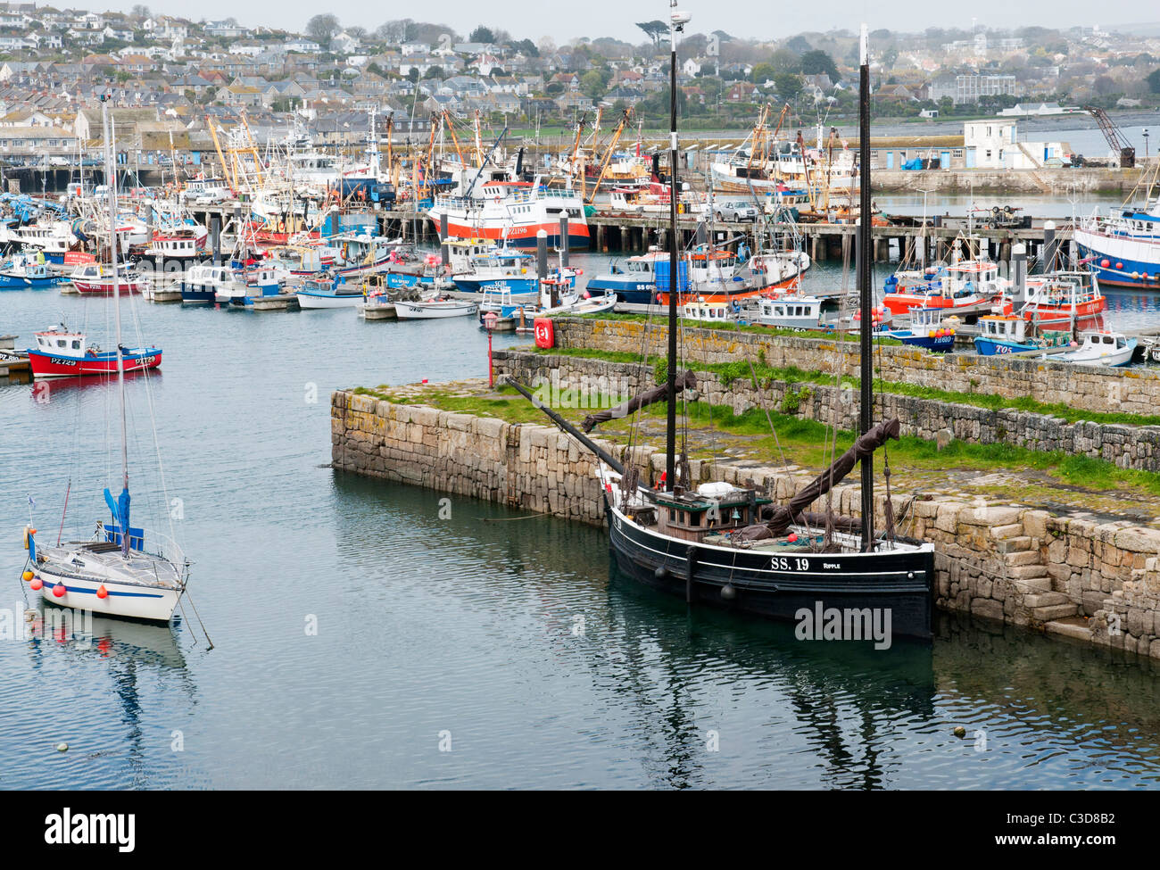 VIew of Newlyn old harbour with restored Cornish sailing Lugger 'Ripple ...
