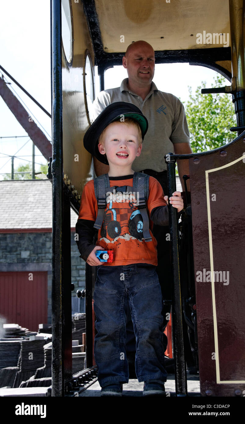 A young boy and engine driver on a steam engine Stock Photo - Alamy