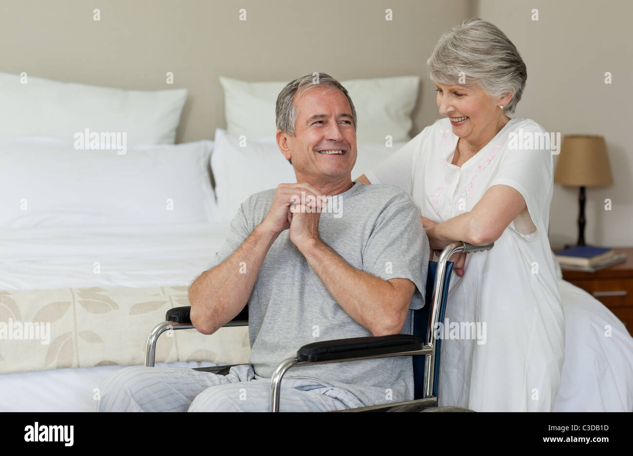 Mature couple in their bedroom Stock Photo - Alamy