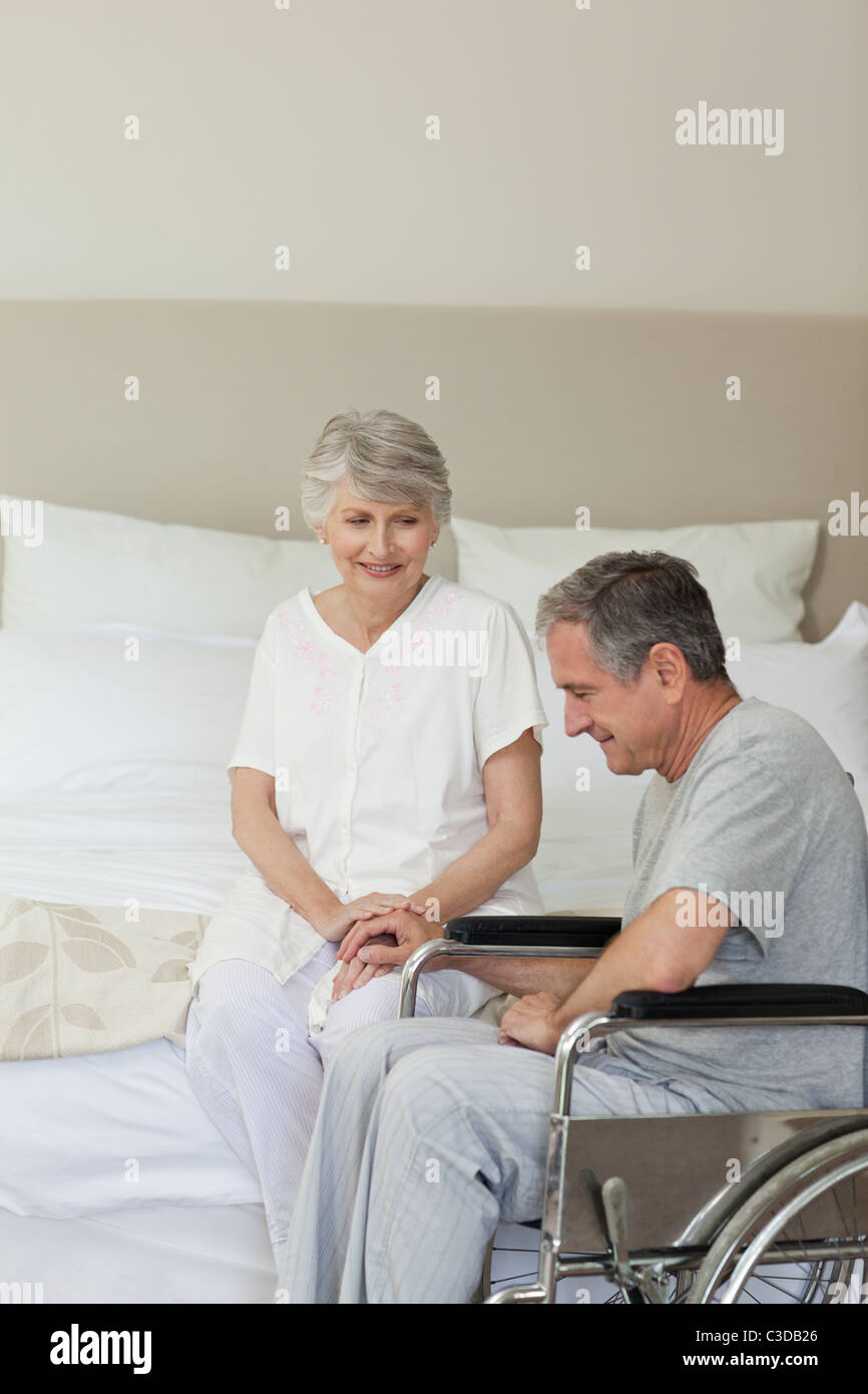 Mature couple in their bedroom Stock Photo - Alamy