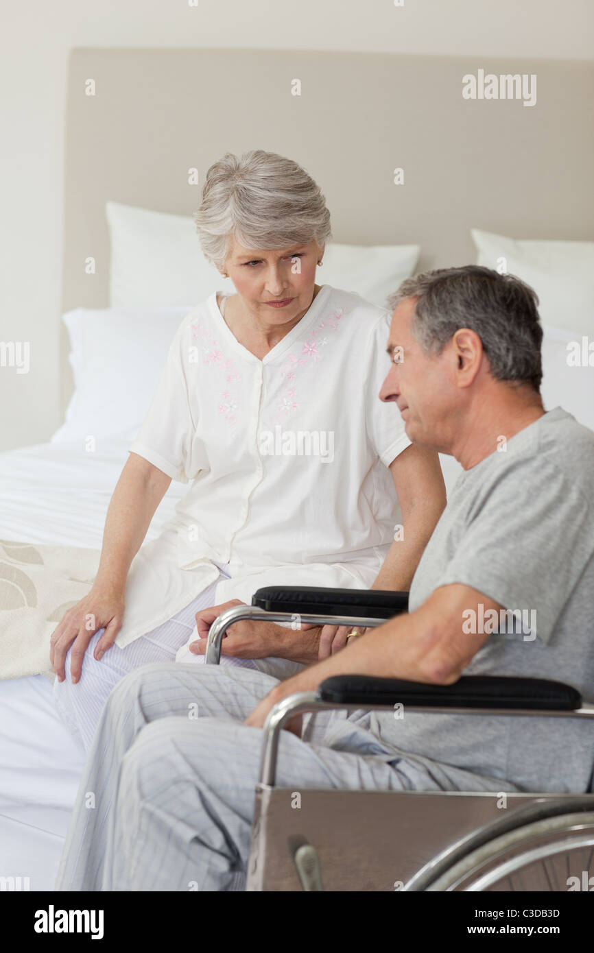 Mature couple in their bedroom Stock Photo - Alamy