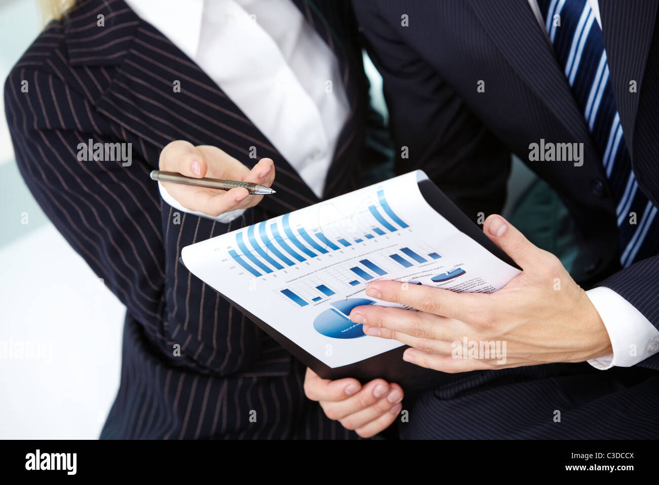 Image of human hand pointing at paper during explanation Stock Photo ...