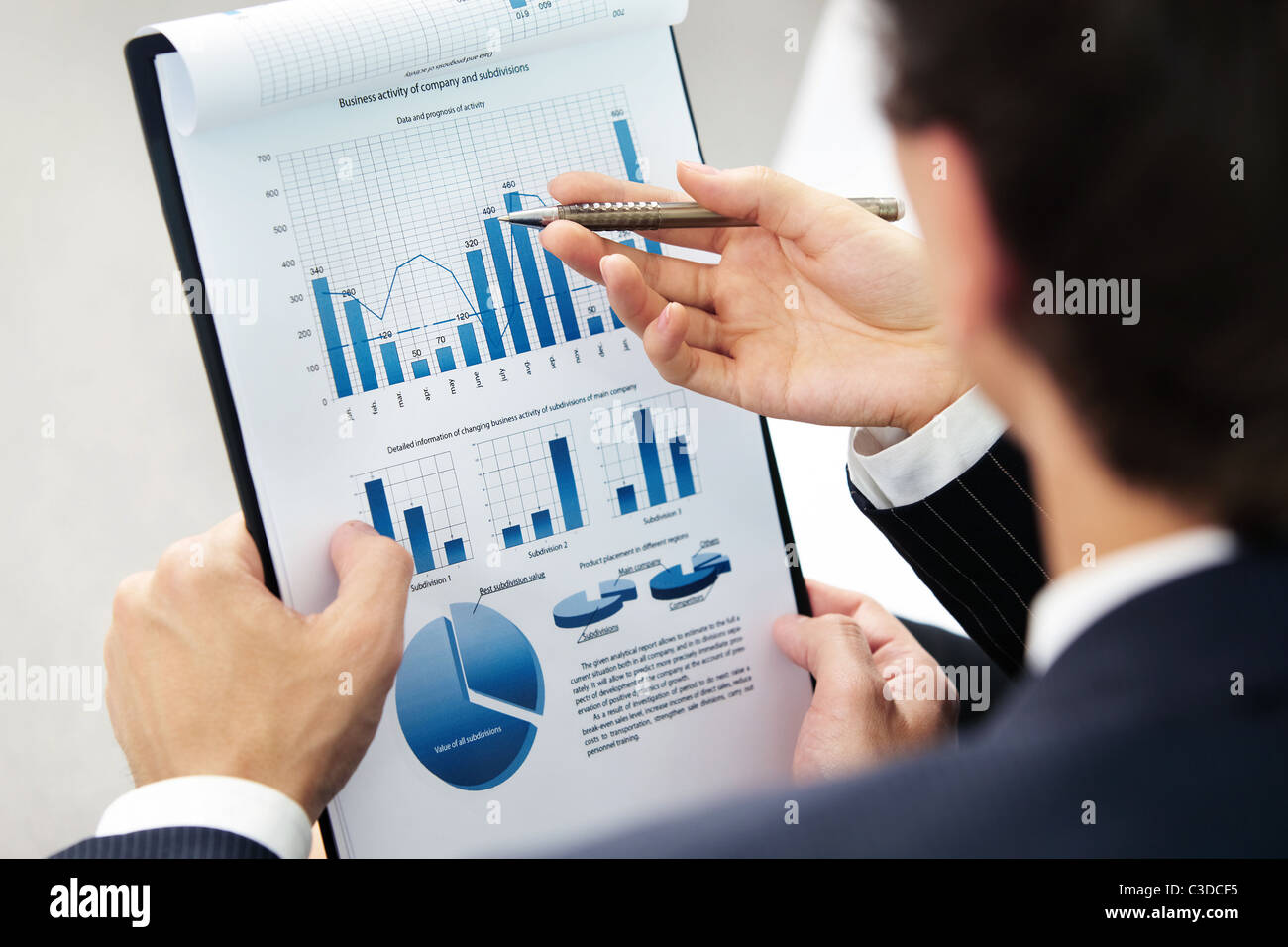 Image of human hand pointing at paper during explanation Stock Photo ...