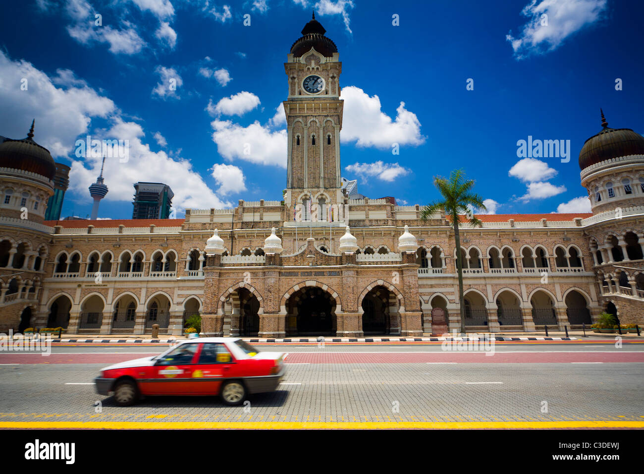 Clock tower of Sultan Abdul Samad with a taxi passing, Merdeka Square ...