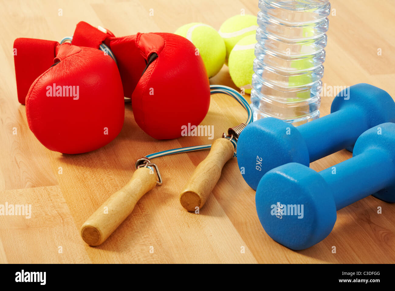Composition of different sportive objects on the floor Stock Photo - Alamy