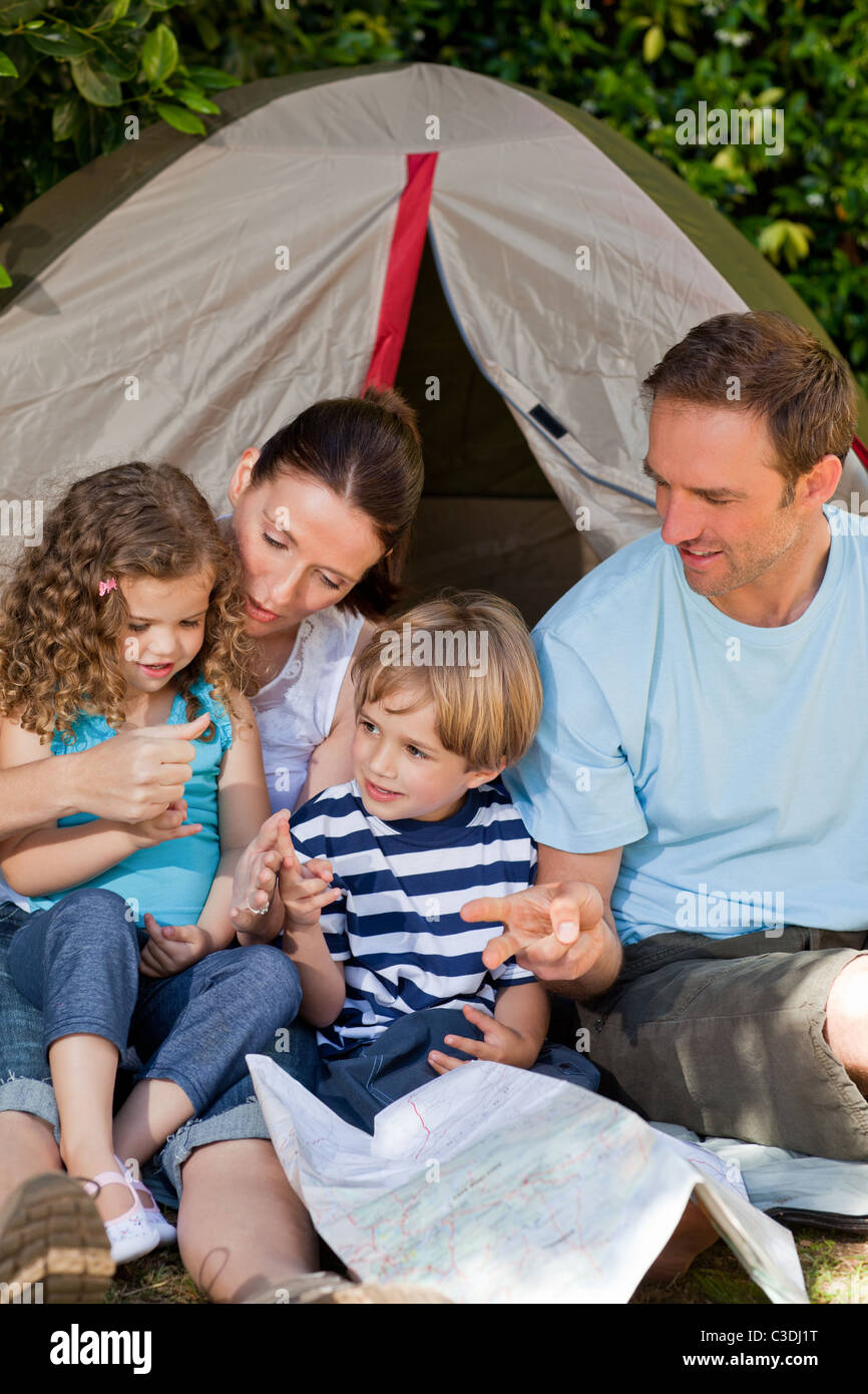 Adorable family camping in the garden Stock Photo - Alamy