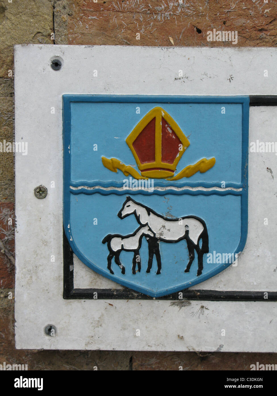 Sign showing city crest, Ely Stock Photo - Alamy