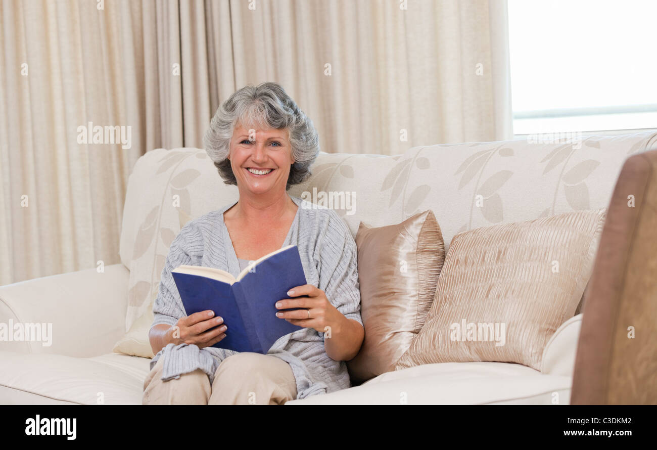 Senior woman reading her book Stock Photo - Alamy