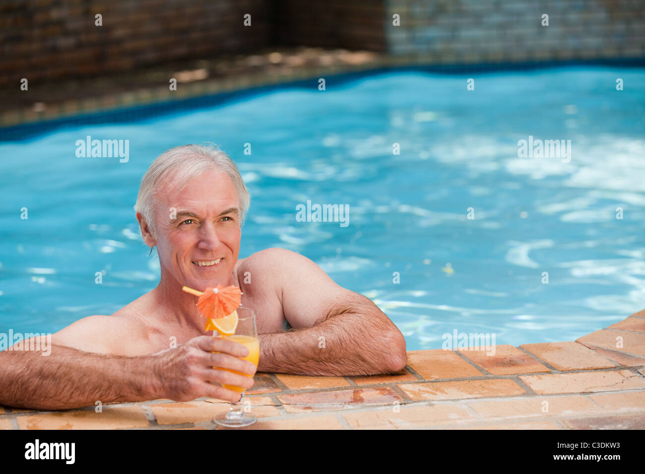 Senior man in his swimming pool Stock Photo - Alamy