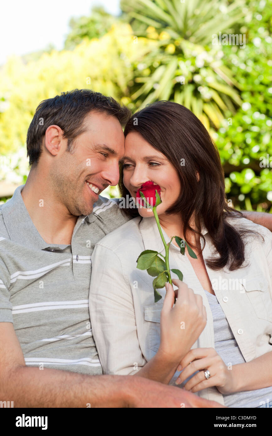 Lovely lovers in the garden Stock Photo - Alamy