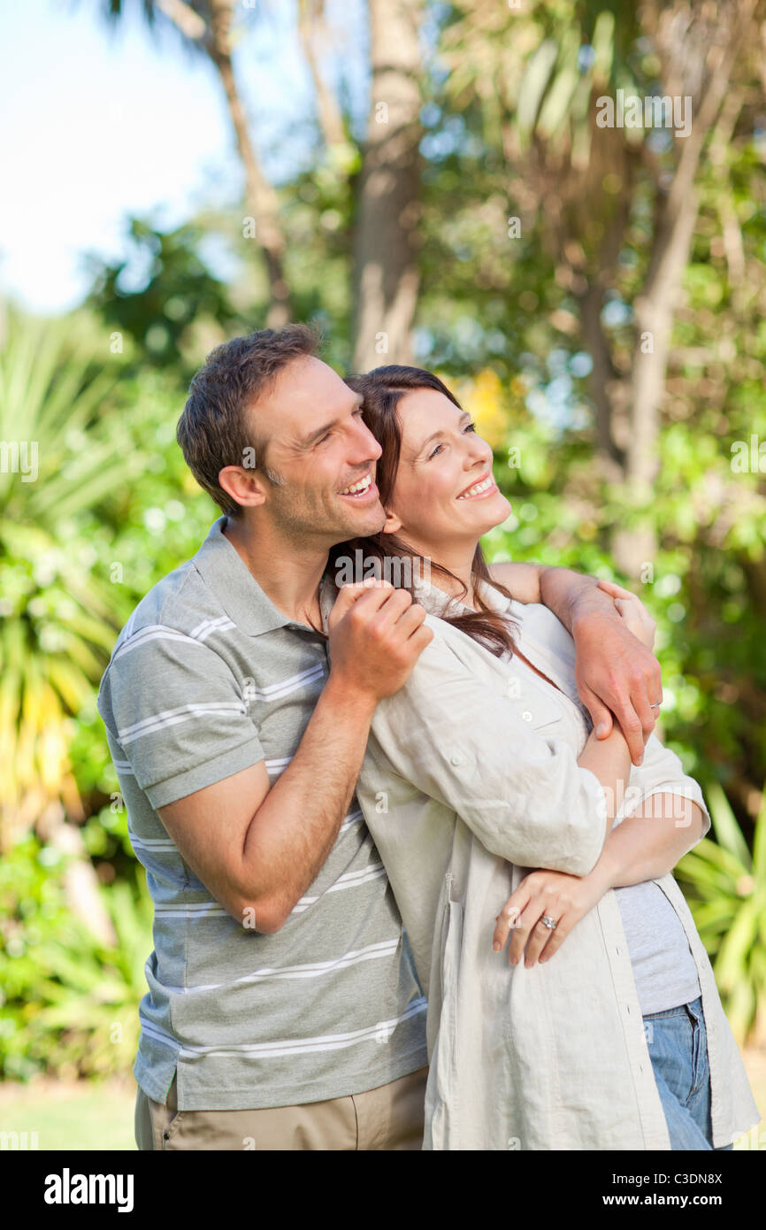 Enamored couple in the garden Stock Photo - Alamy