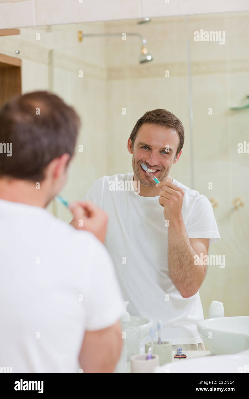 Man brushing his teeth Stock Photo - Alamy