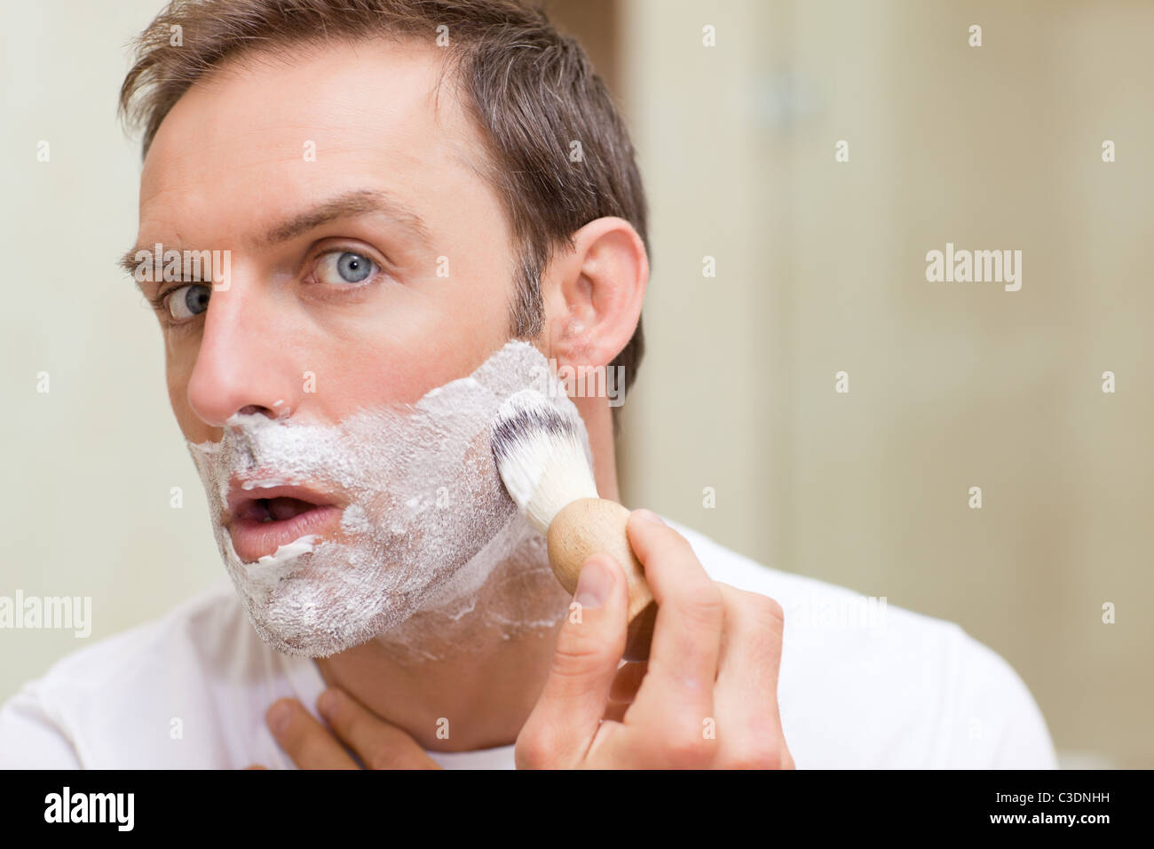 Man shaving in the bathroom Stock Photo - Alamy